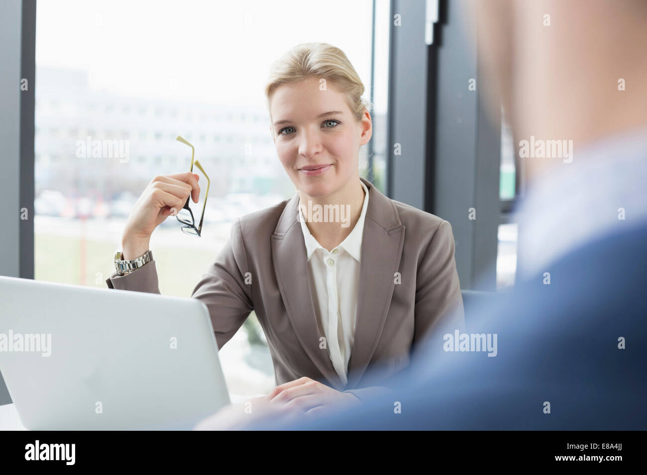 Colleagues having counseling interview in office Stock Photo - Alamy
