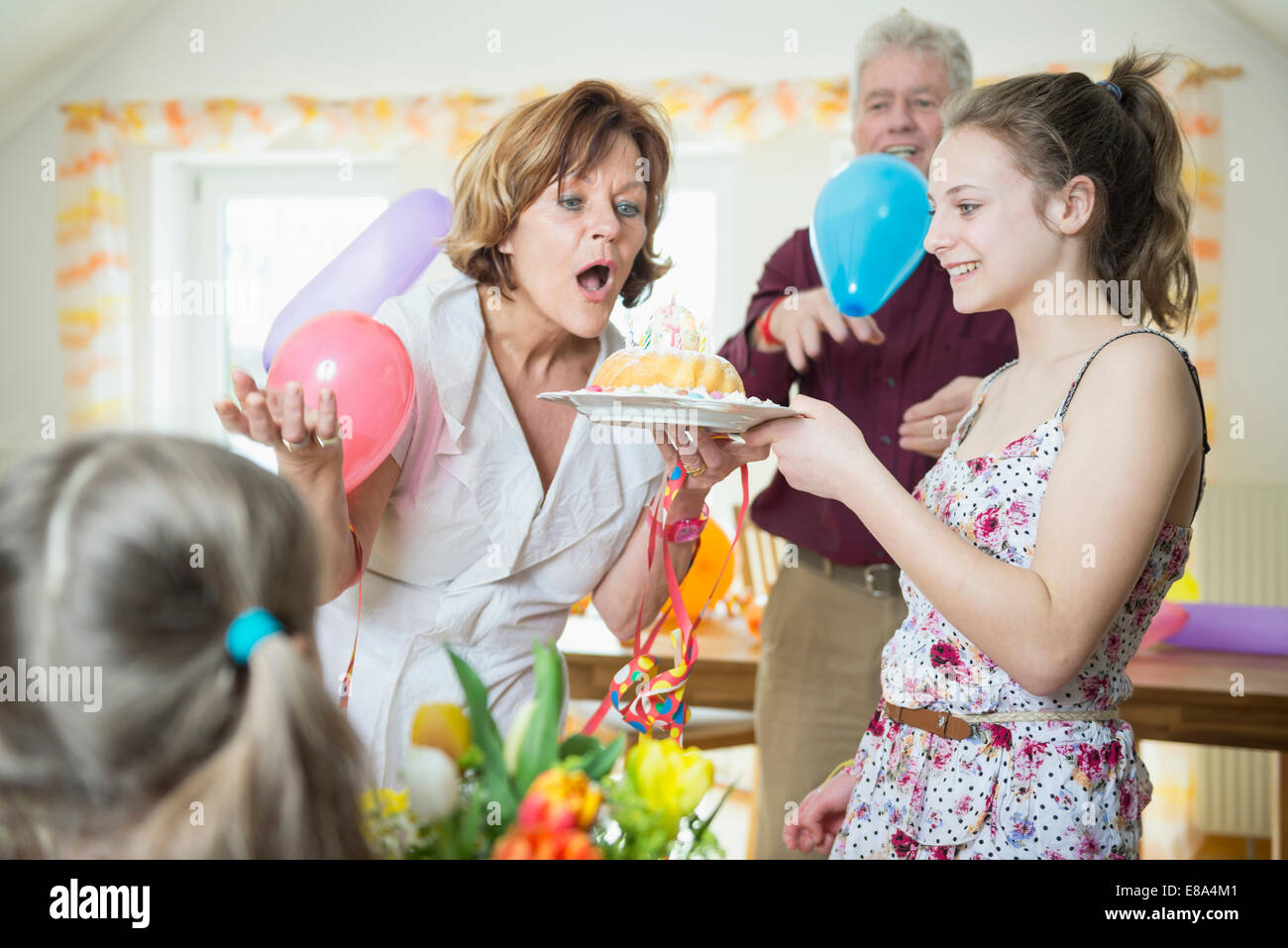 Family celebrating birthday party Stock Photo - Alamy