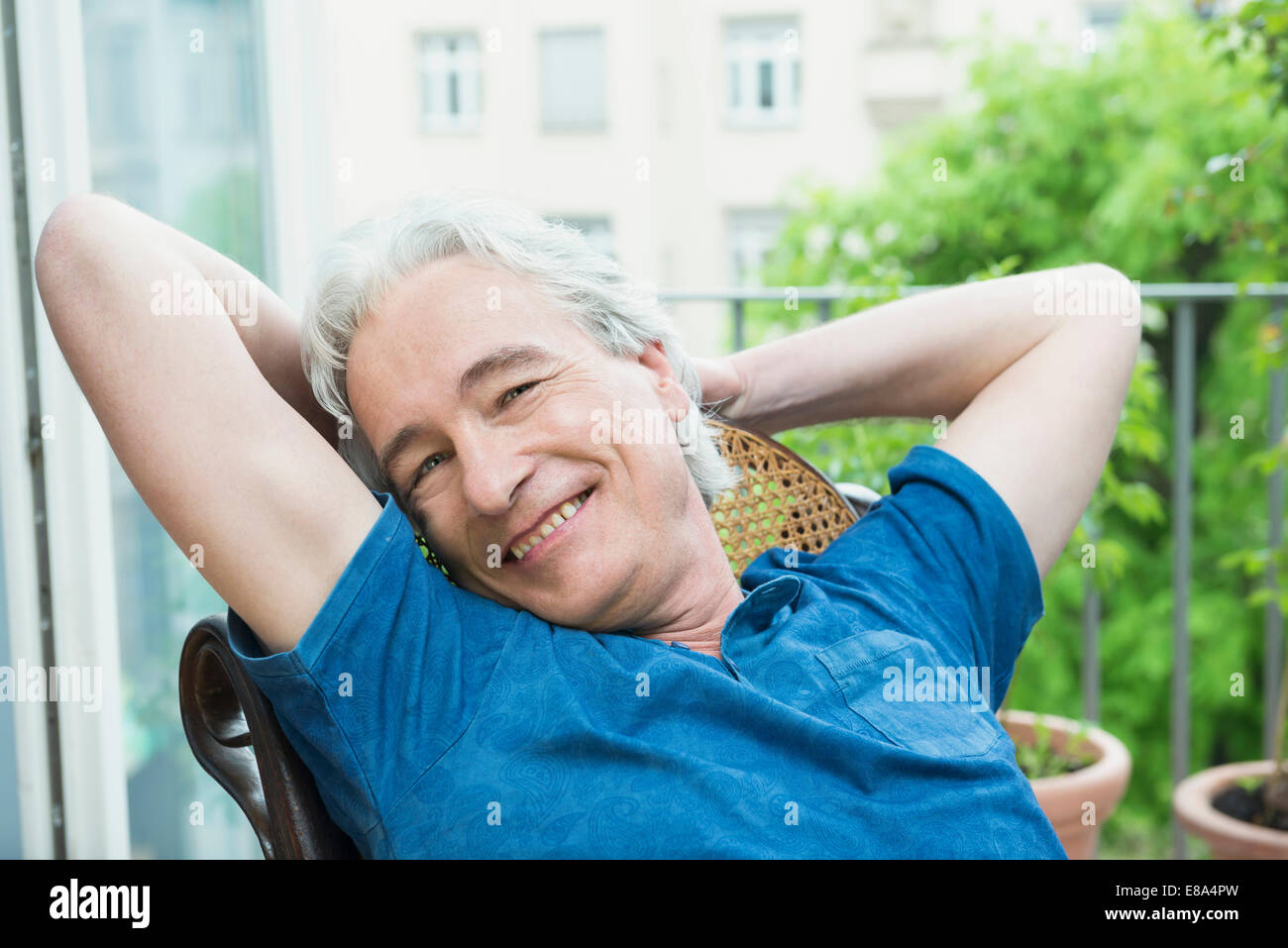 Man sitting on rocking chair hi-res stock photography and images - Alamy
