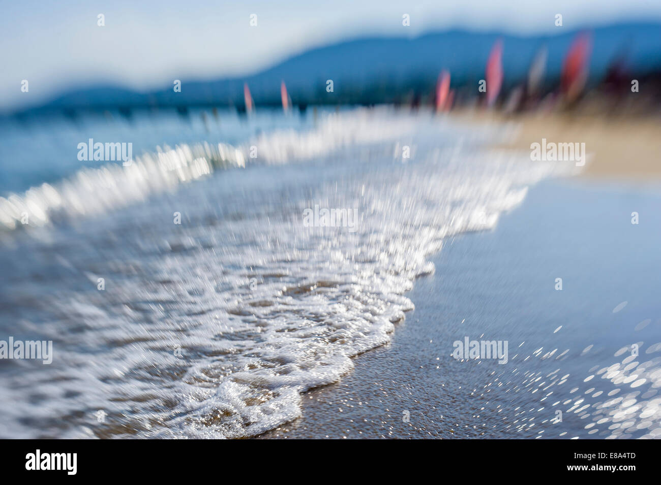 Foamy sea waves go at sandy beach hi-res stock photography and images ...