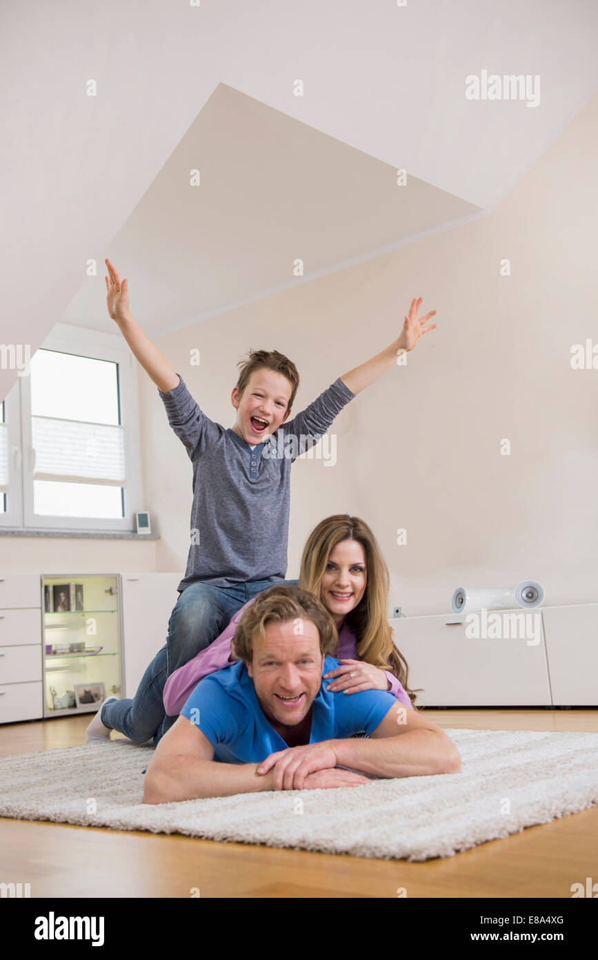 Happy family relaxing at home Stock Photo - Alamy
