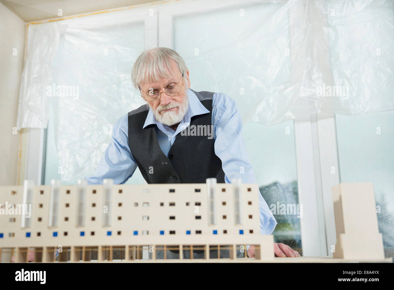 Portrait architect looking building model hi-res stock photography and ...