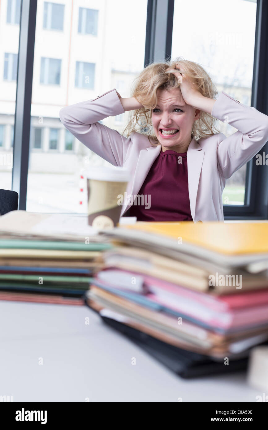 businesswoman desperate in office Stock Photo - Alamy