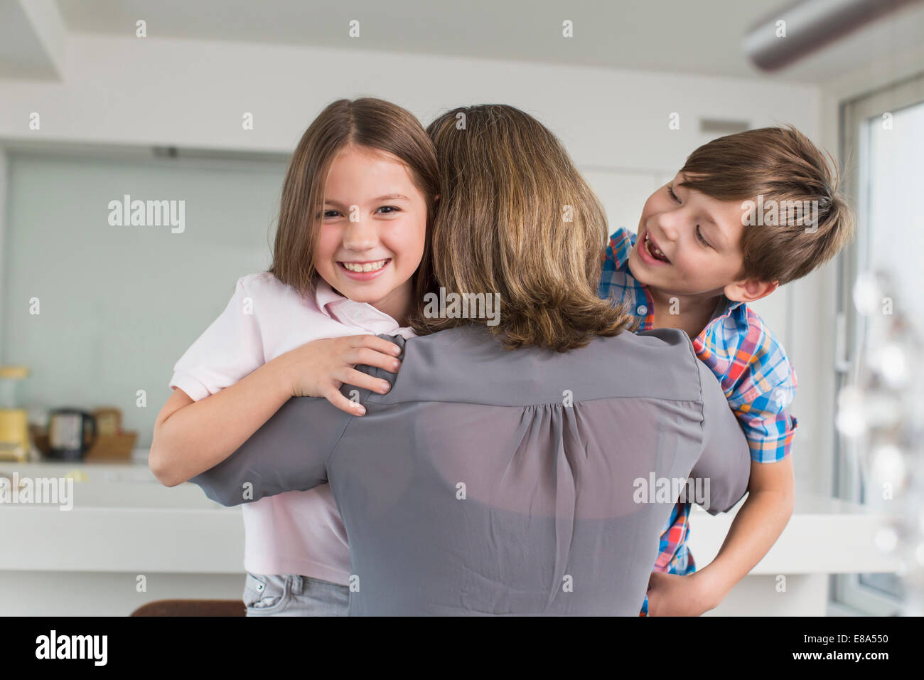 Brother sister hugging rear view hi-res stock photography and images ...