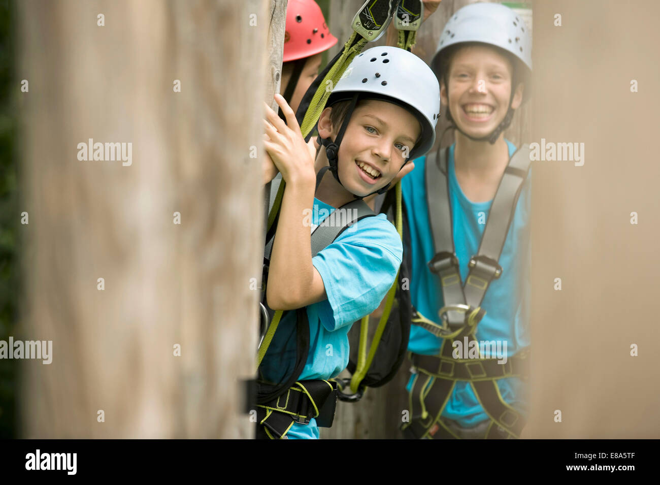 Boy and girls climbing crag hi-res stock photography and images - Alamy