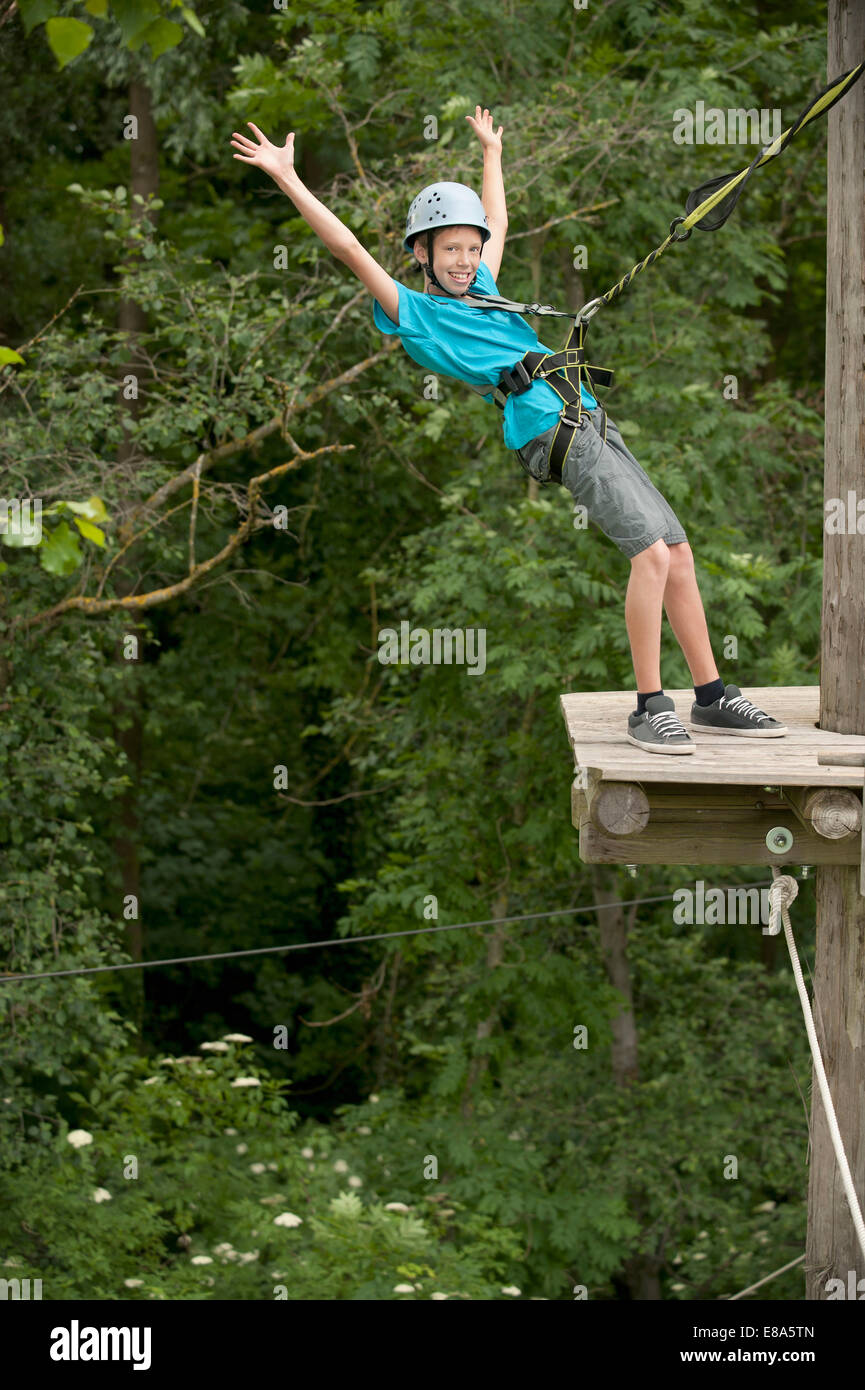 Boys climbing tree boy boy climb tree hi-res stock photography and ...