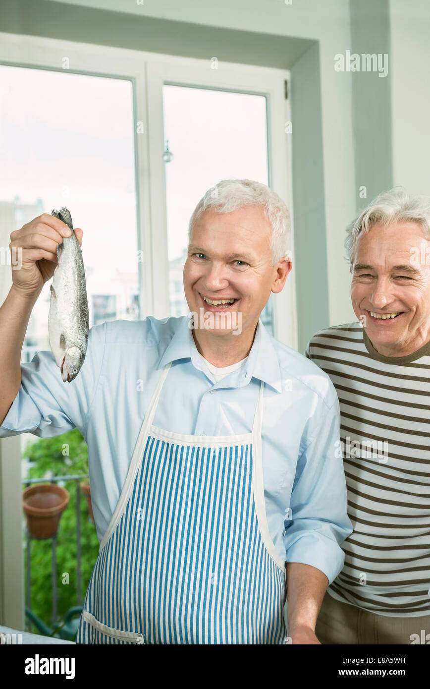 Mature men presenting trout fish hi-res stock photography and images ...