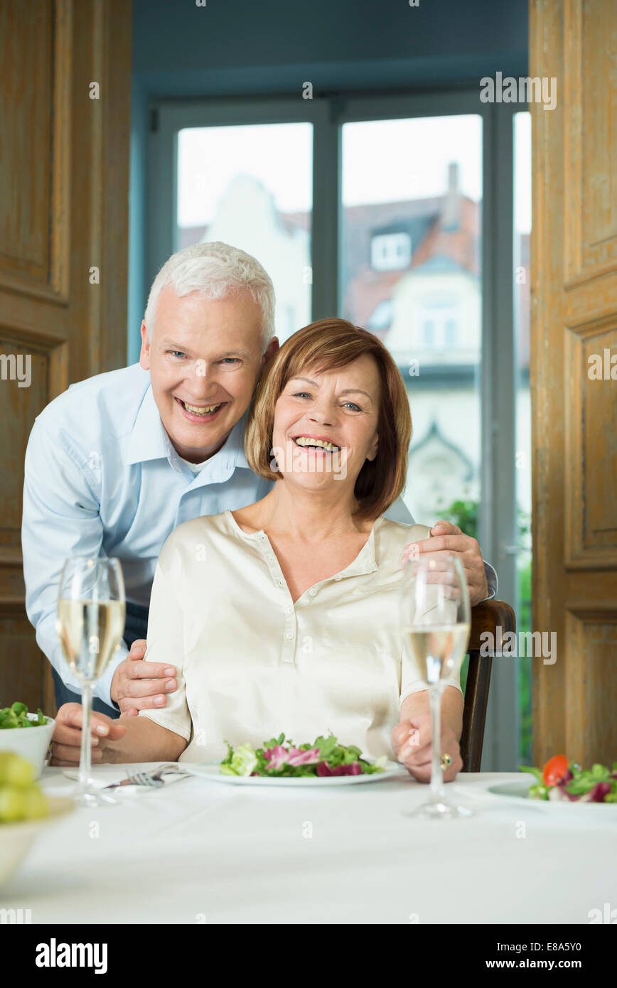 Woman bending over table hi-res stock photography and images - Alamy