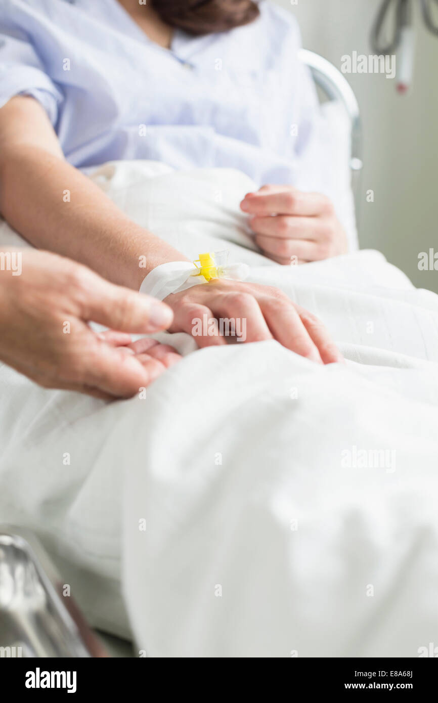 Doctor preparing infusion needle Stock Photo - Alamy