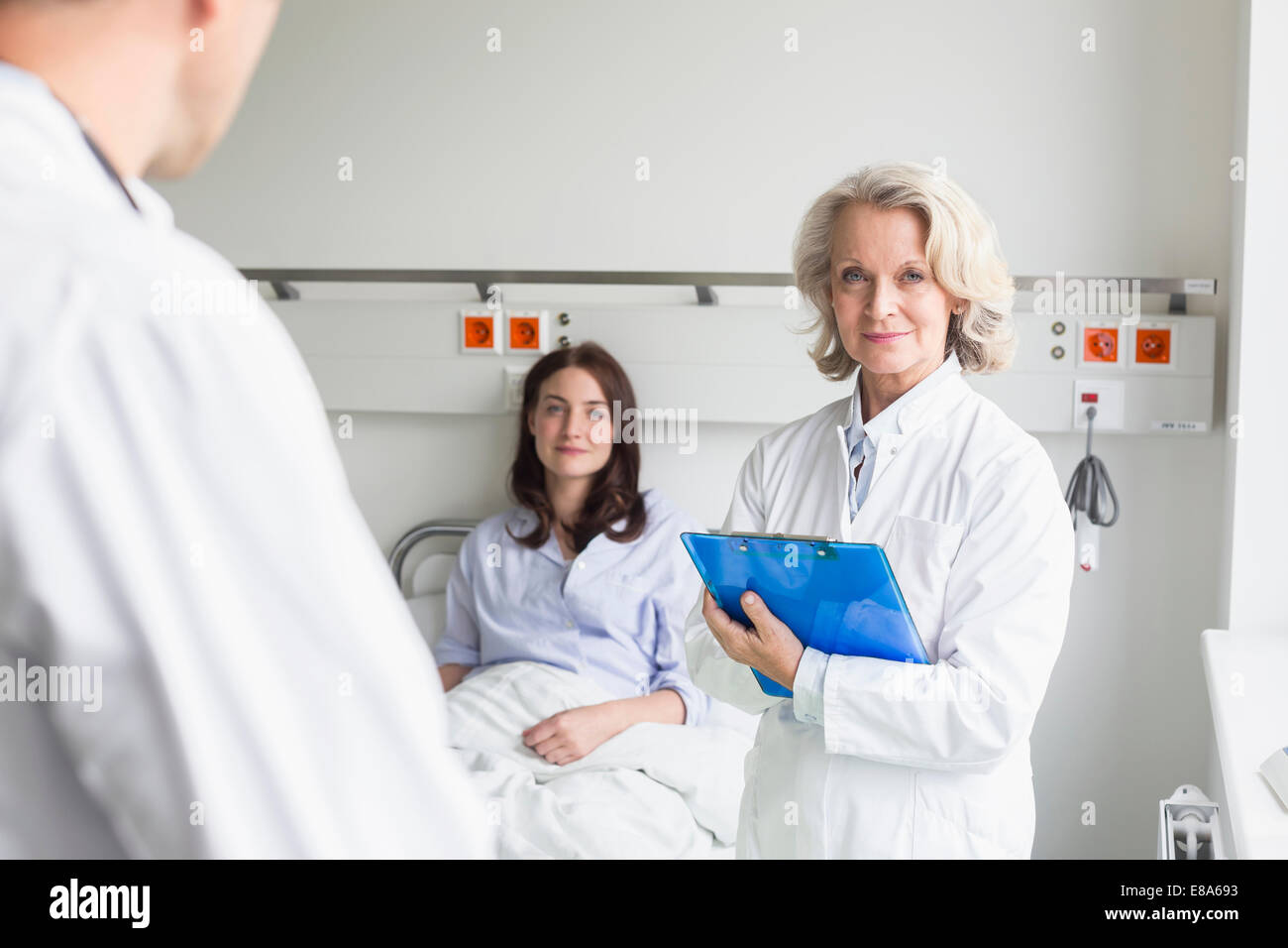 Doctors' visit in hospital Stock Photo - Alamy