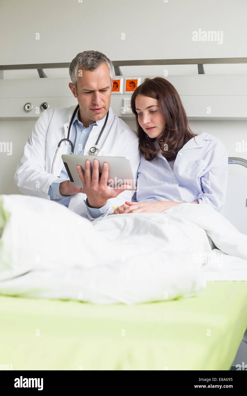 Doctor discussing treatment with patient Stock Photo - Alamy