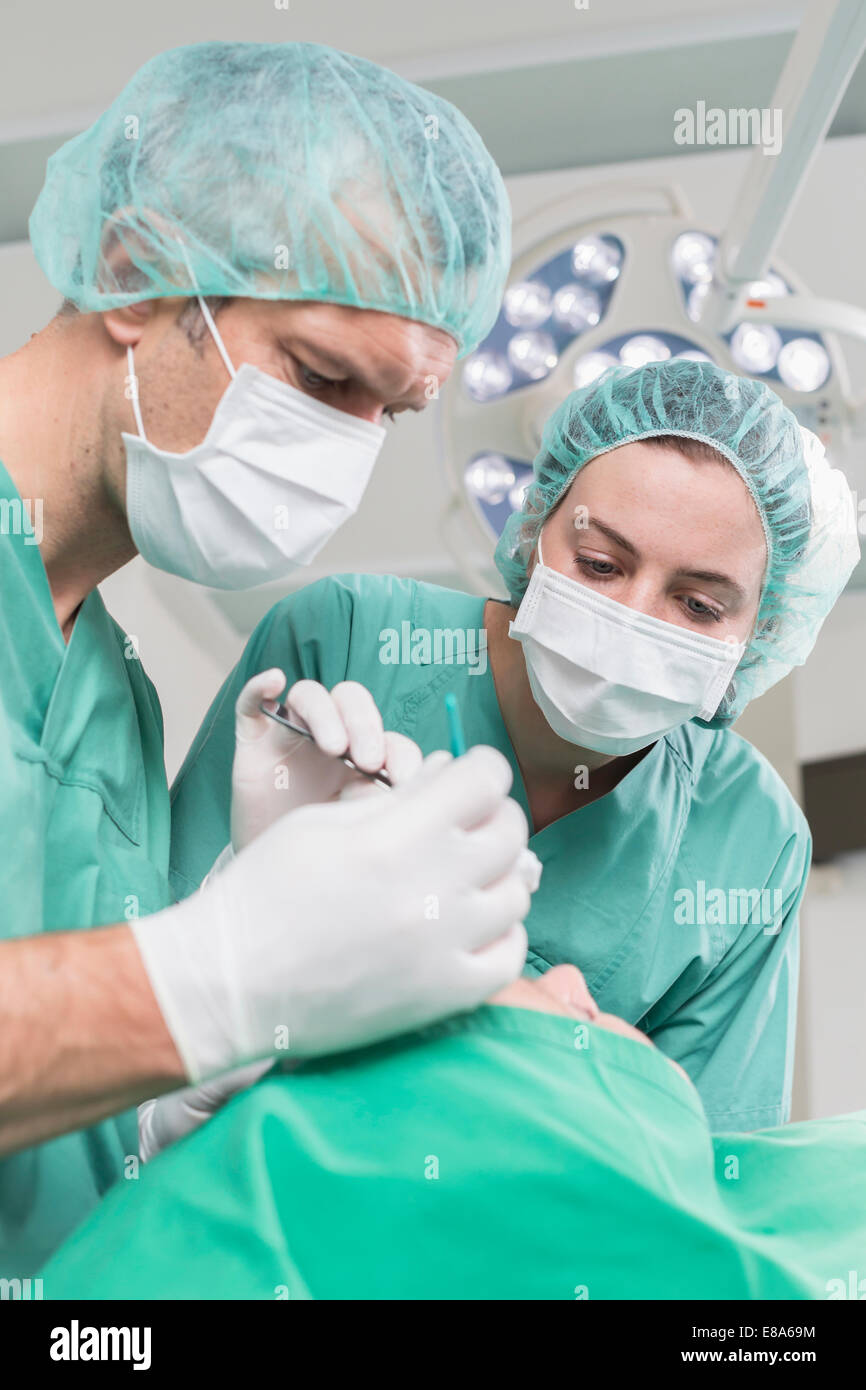 Surgeons performing operation Stock Photo - Alamy