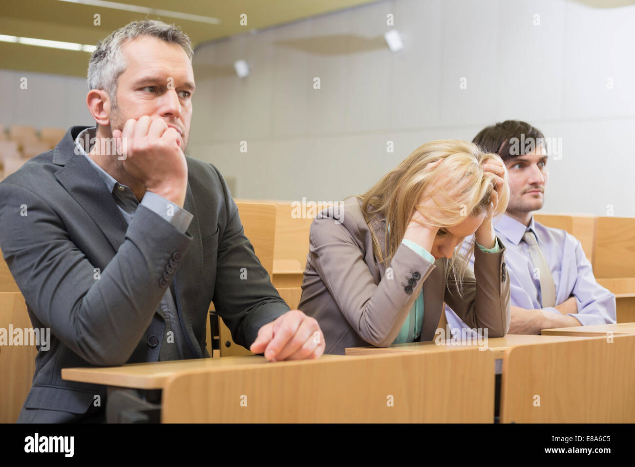 Bored businesspeople sitting in auditorium Stock Photo - Alamy Bored businesspeople sitting in auditorium Stock Photo - Alamy