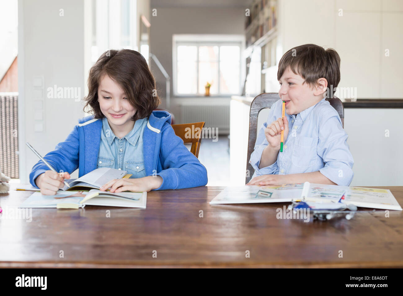 Boy doing homework color pencil hi-res stock photography and images - Alamy