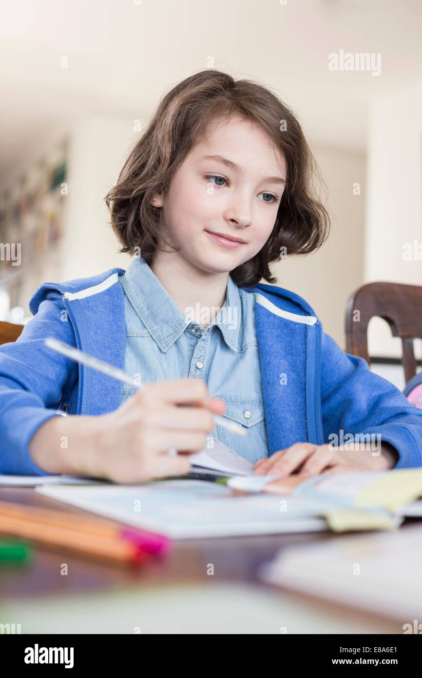 Girl doing homework Stock Photo - Alamy