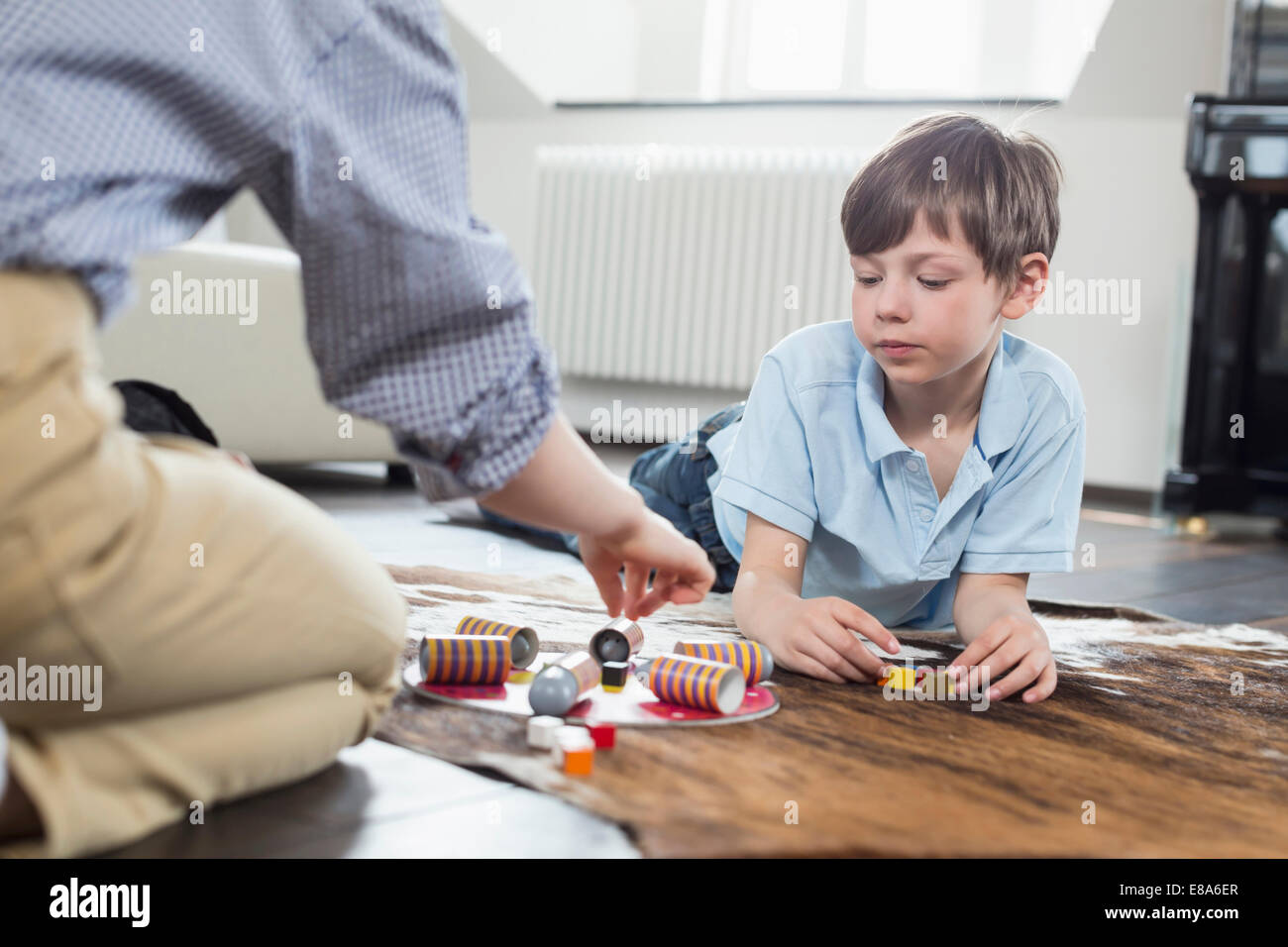 Girl and boy playing board game Stock Photo - Alamy