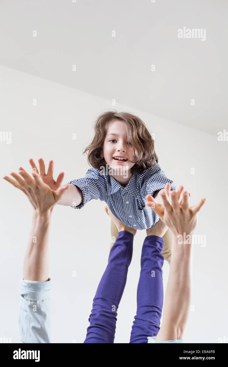 Mother balancing her daughter on her feet Stock Photo - Alamy