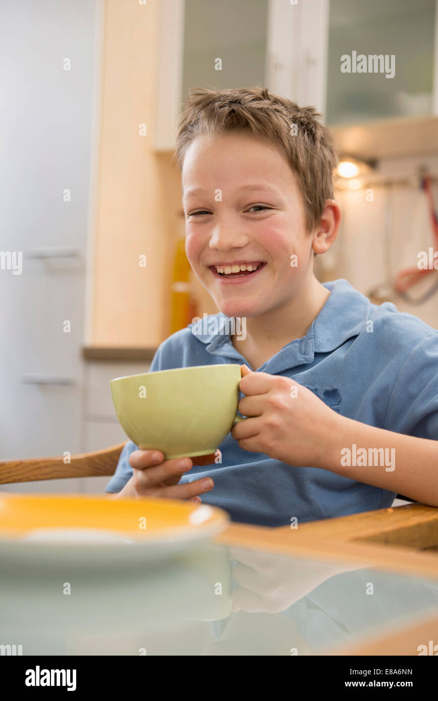Kids holding cup hi-res stock photography and images - Alamy