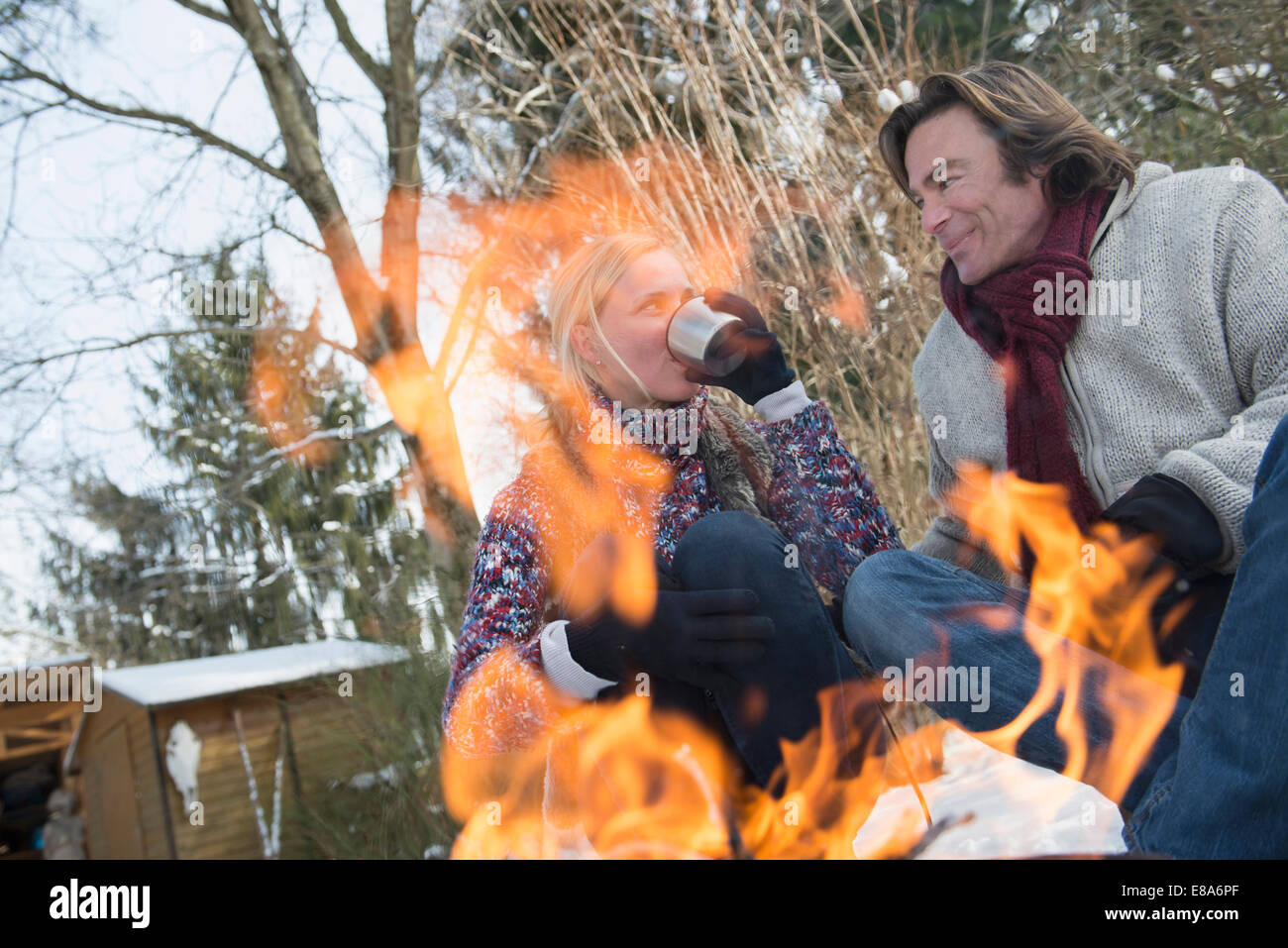 Couple sitting by fire hi-res stock photography and images - Alamy