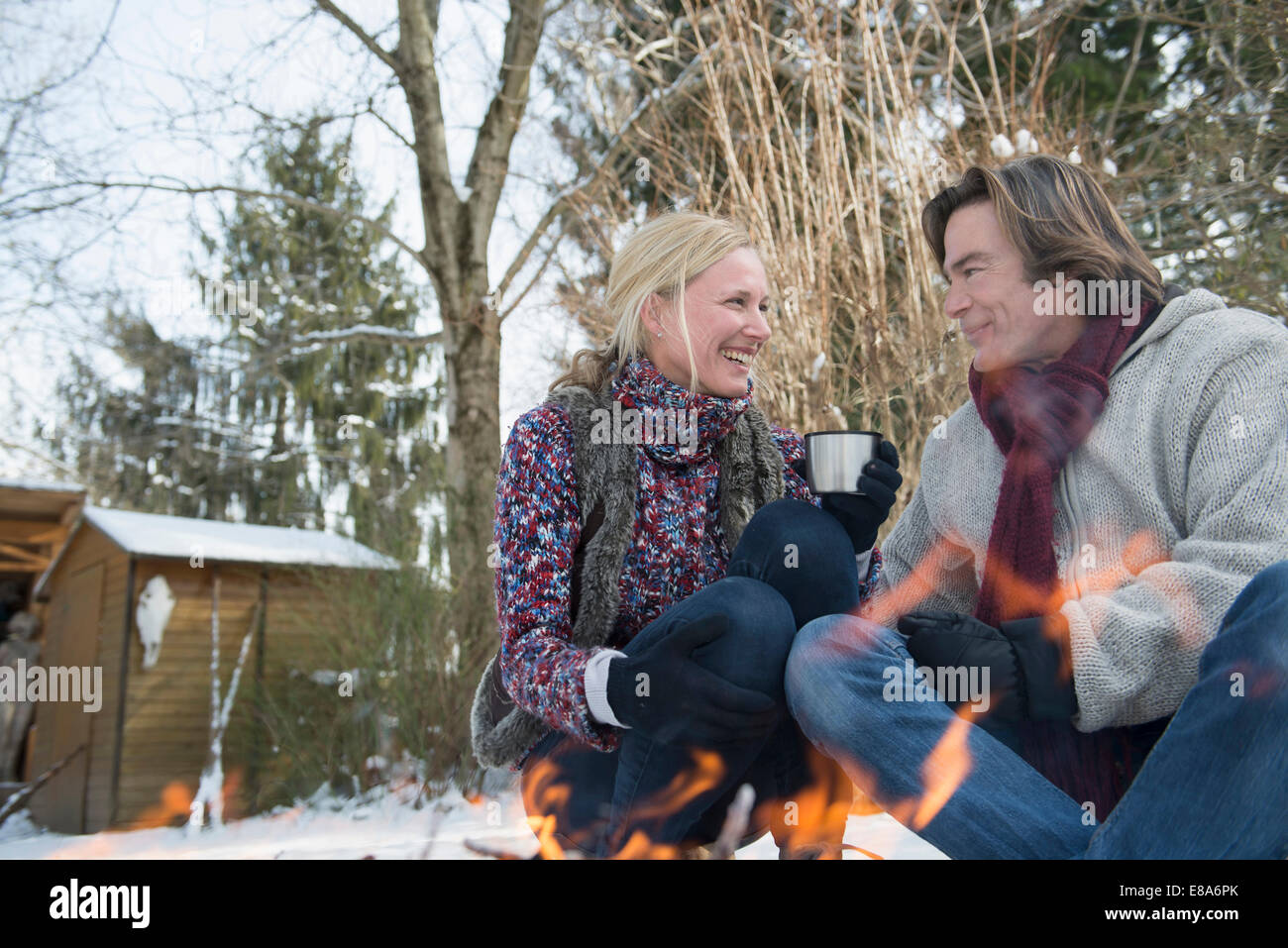 Man sitting fire drink hi-res stock photography and images - Alamy