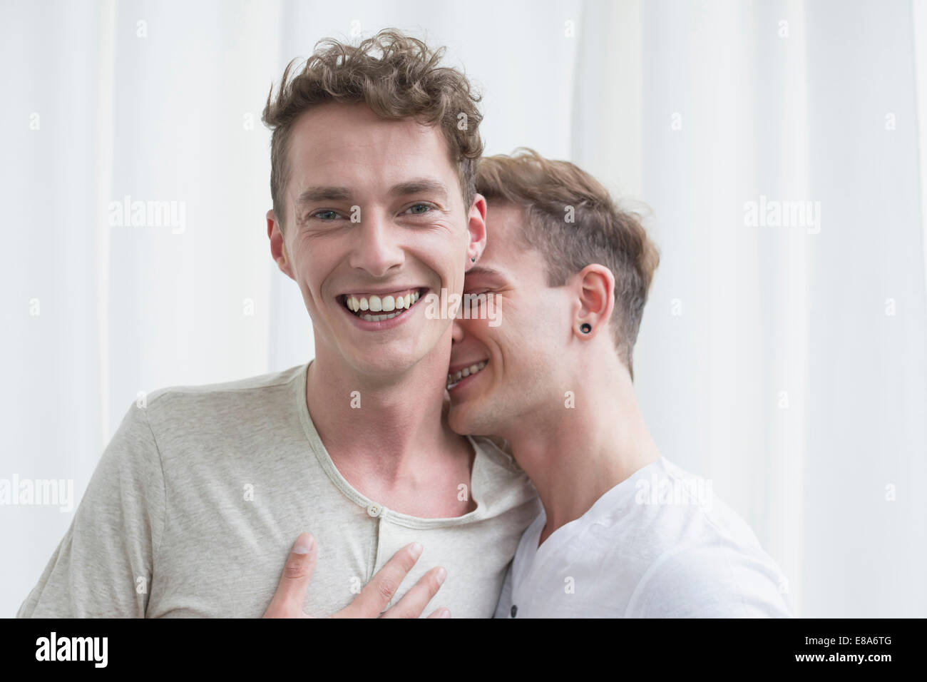 Homosexual couple embracing each other, smiling Stock Photo - Alamy