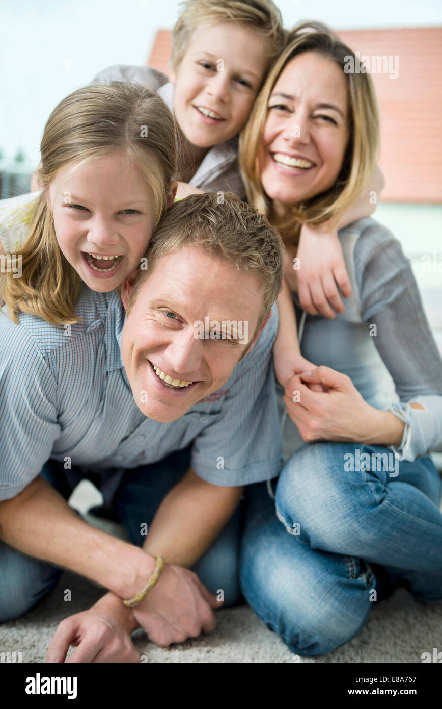 Happy family with two kids at home Stock Photo - Alamy