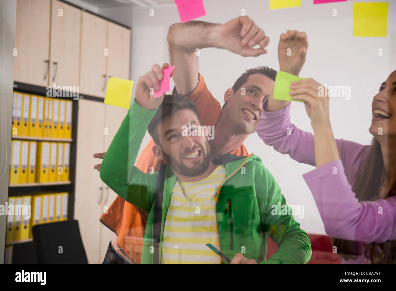 Three business people fighting hi-res stock photography and images - Alamy