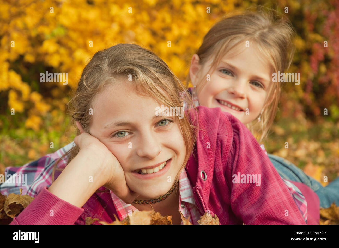 Sisters smiling, portrait Stock Photo - Alamy