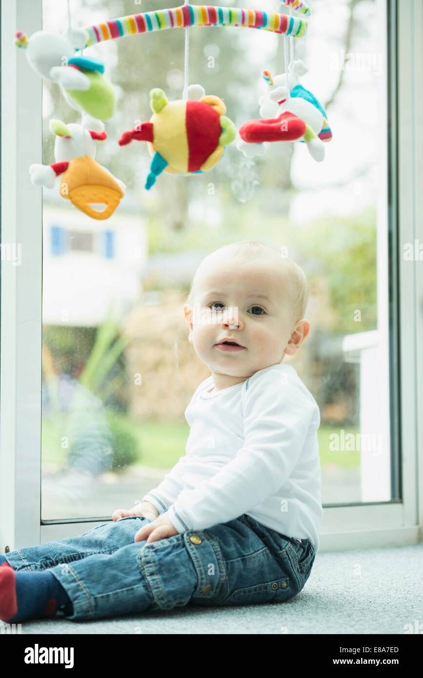 Toddler and mobile Stock Photo - Alamy