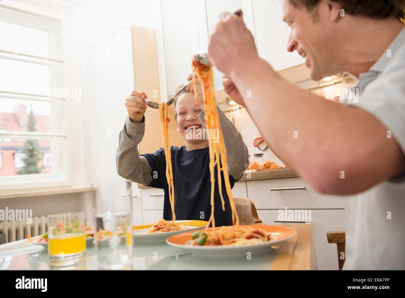 Man Eating Spaghetti With Tomato Sauce High Resolution Stock ...