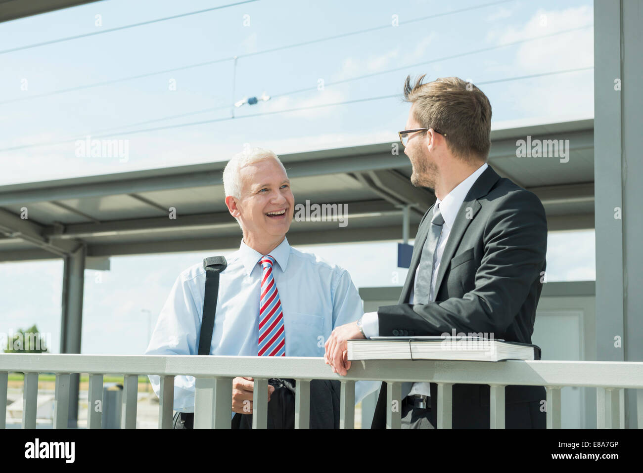 two business partners talking Stock Photo - Alamy