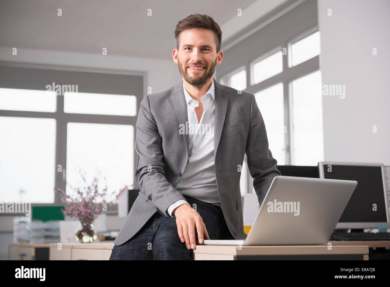 Young handsome business man office computer Stock Photo - Alamy