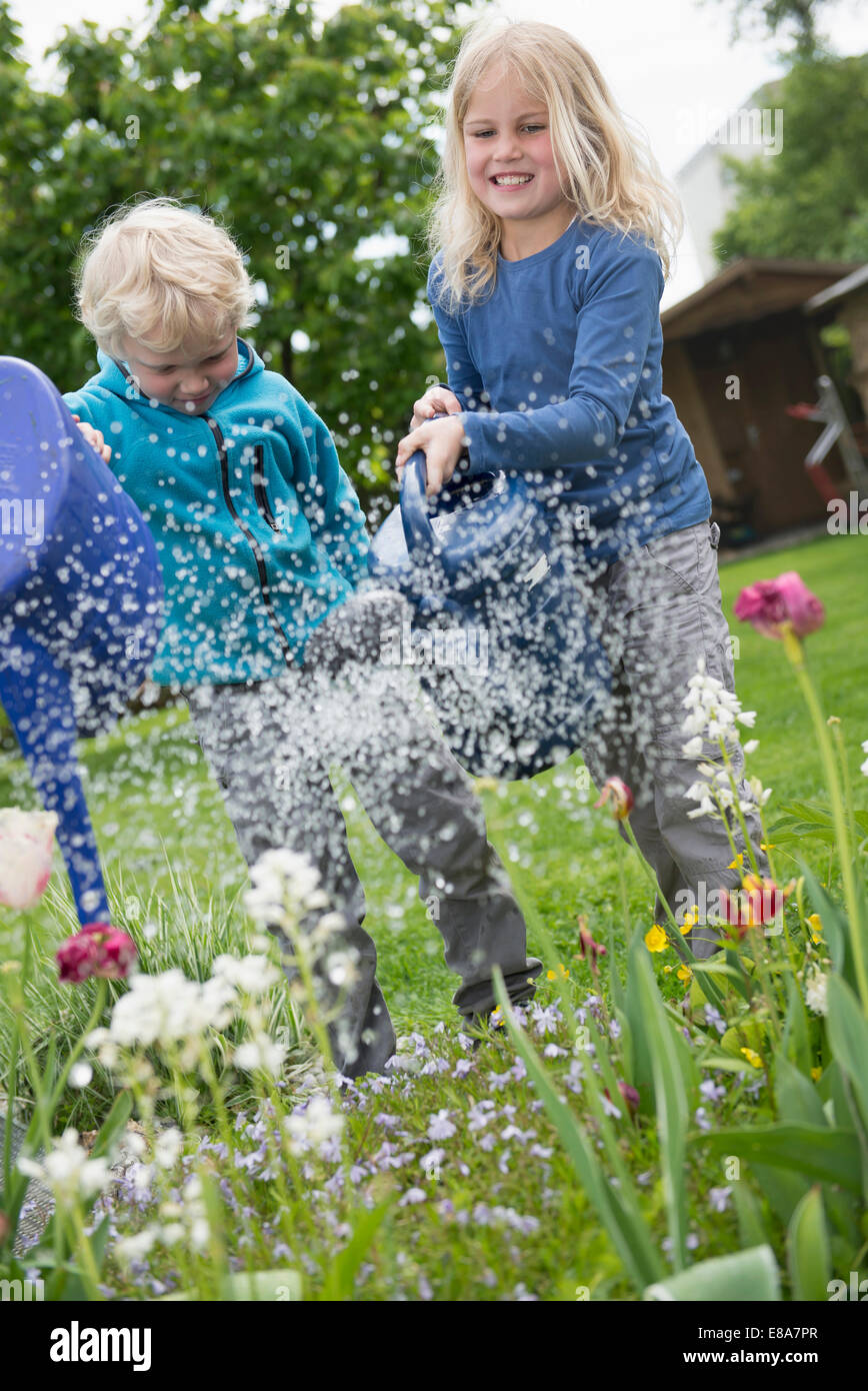 Kids watering can hi-res stock photography and images - Alamy