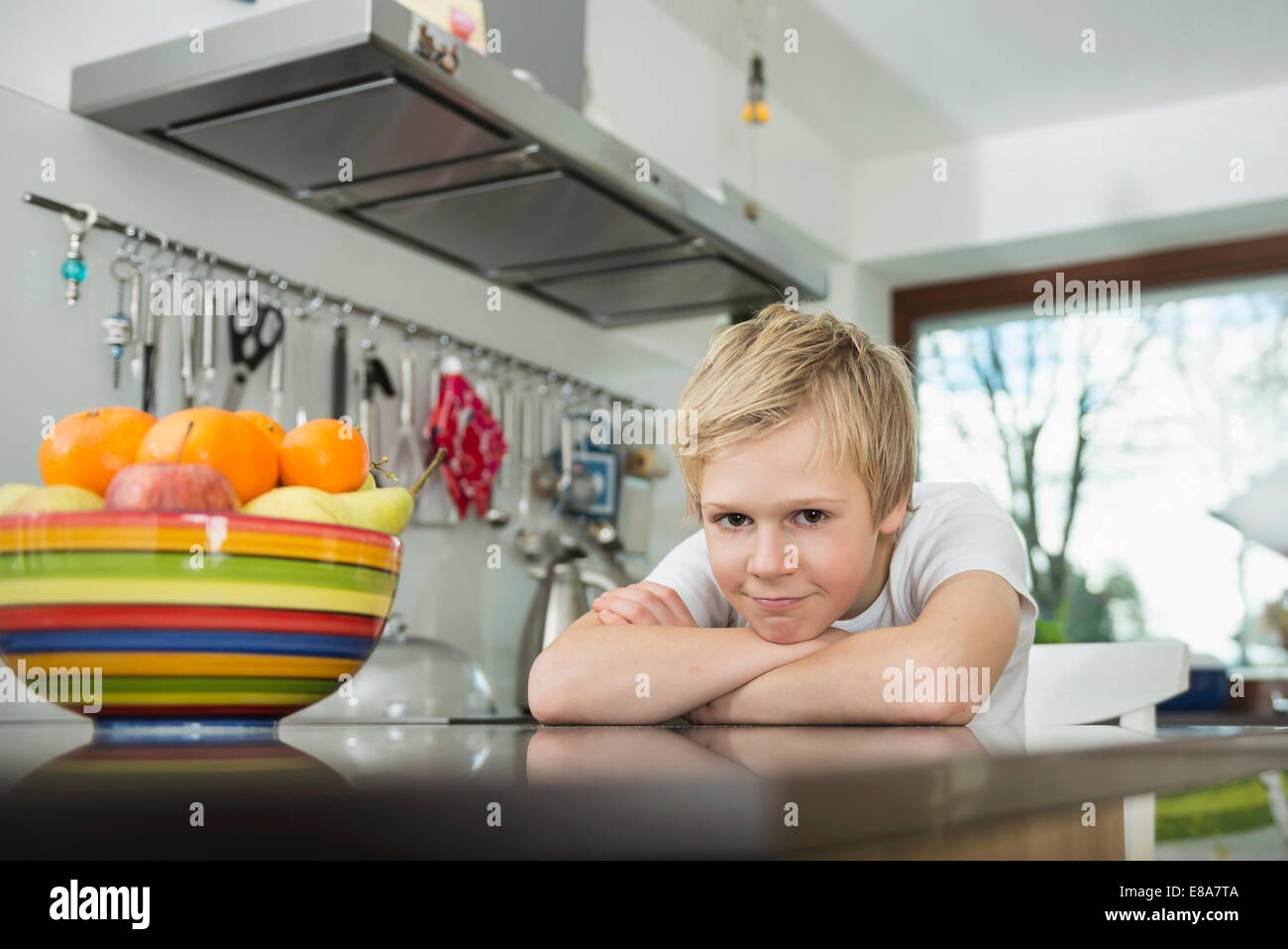 Portrait of smiling boy at home in the kitchen Stock Photo - Alamy
