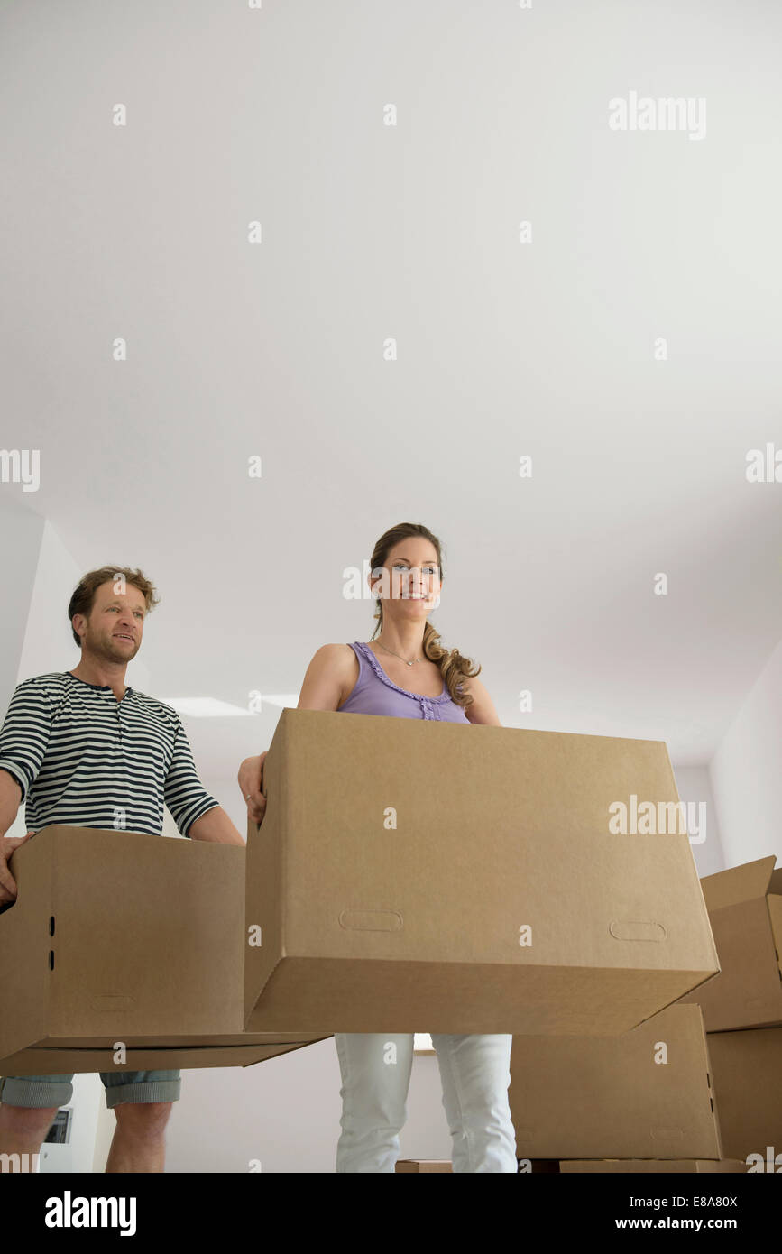 Woman carrying boxes new home hi-res stock photography and images - Alamy