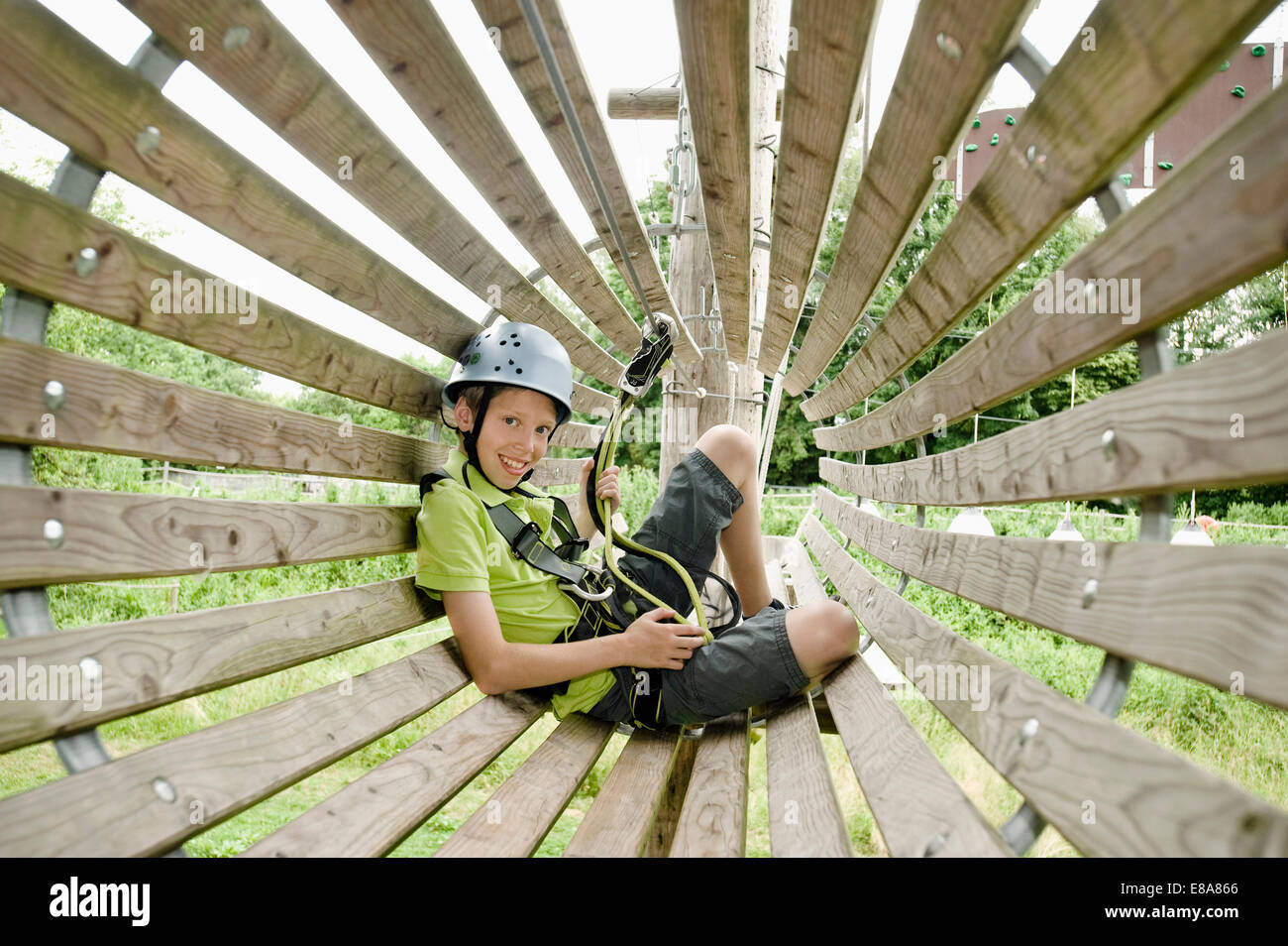 Portrait of boy climbing crag, smiling Stock Photo - Alamy