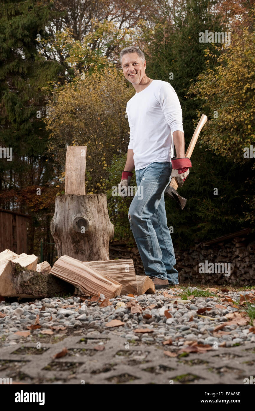 Man chopping wood Stock Photo - Alamy