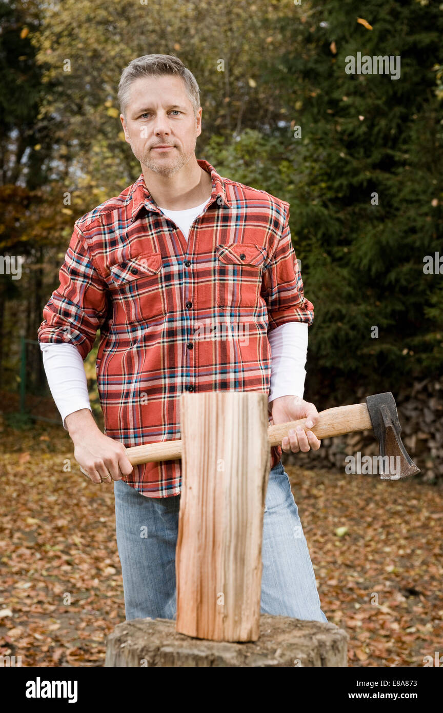 Man chopping wood Stock Photo - Alamy
