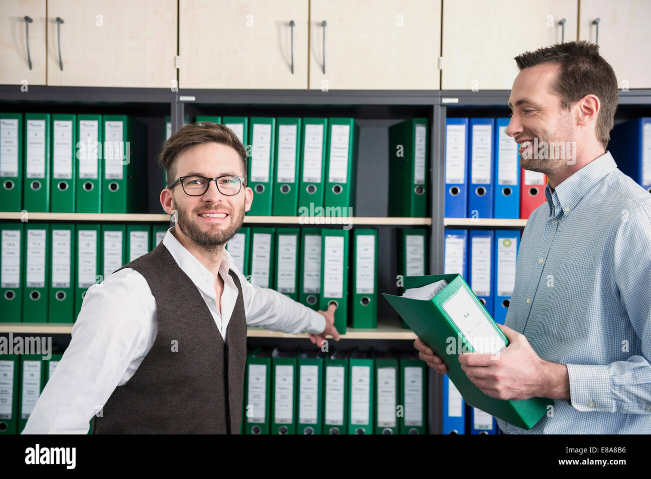Men portrait filing cabinet organizing Stock Photo - Alamy