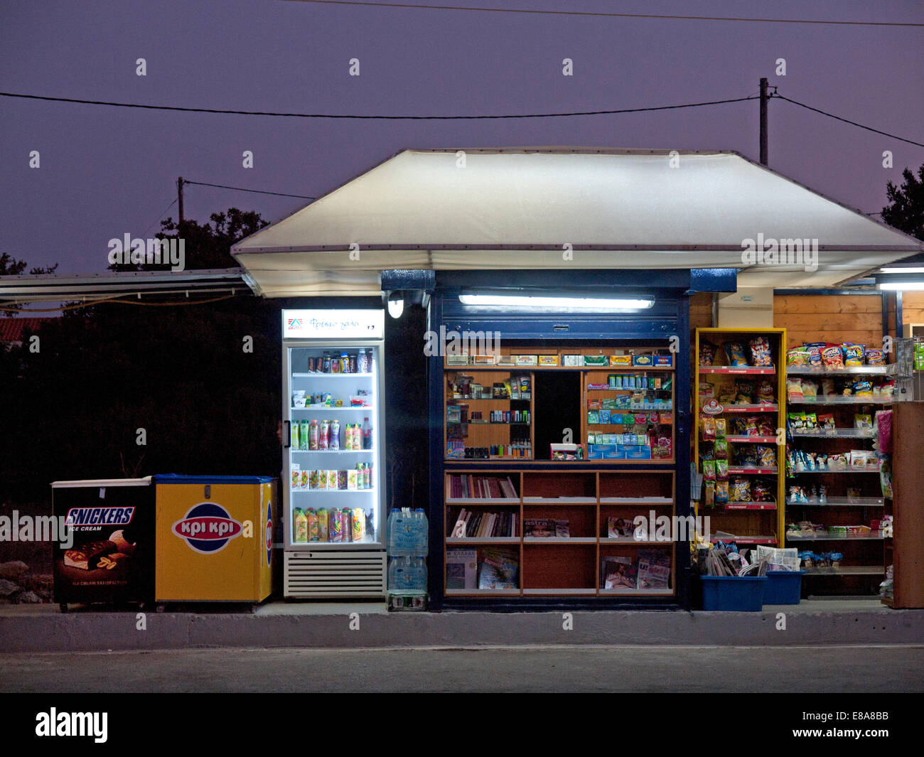 A kiosk at night in Greece Stock Photo - Alamy