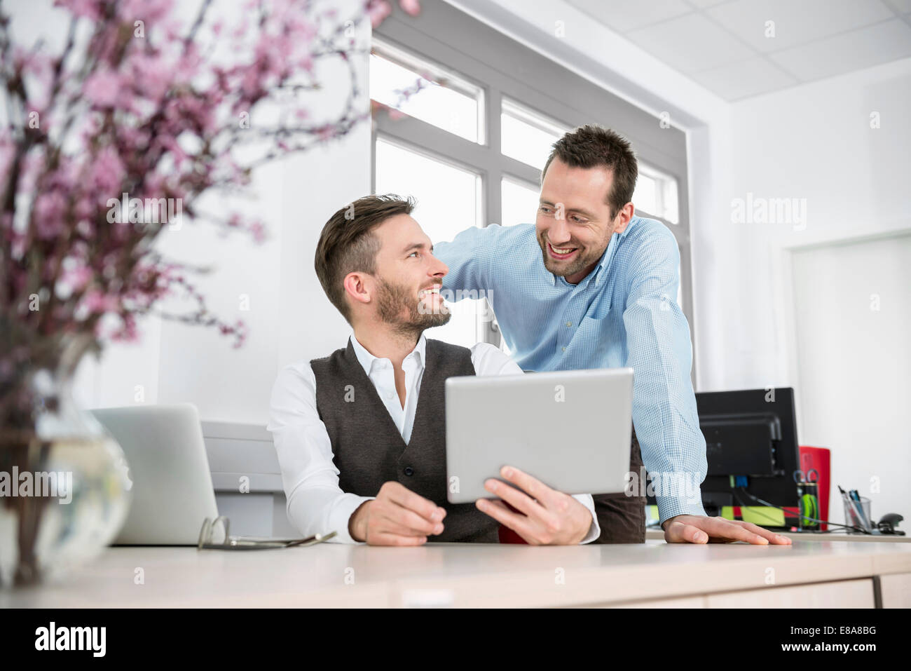 Two men planning meeting tablet computer Stock Photo - Alamy
