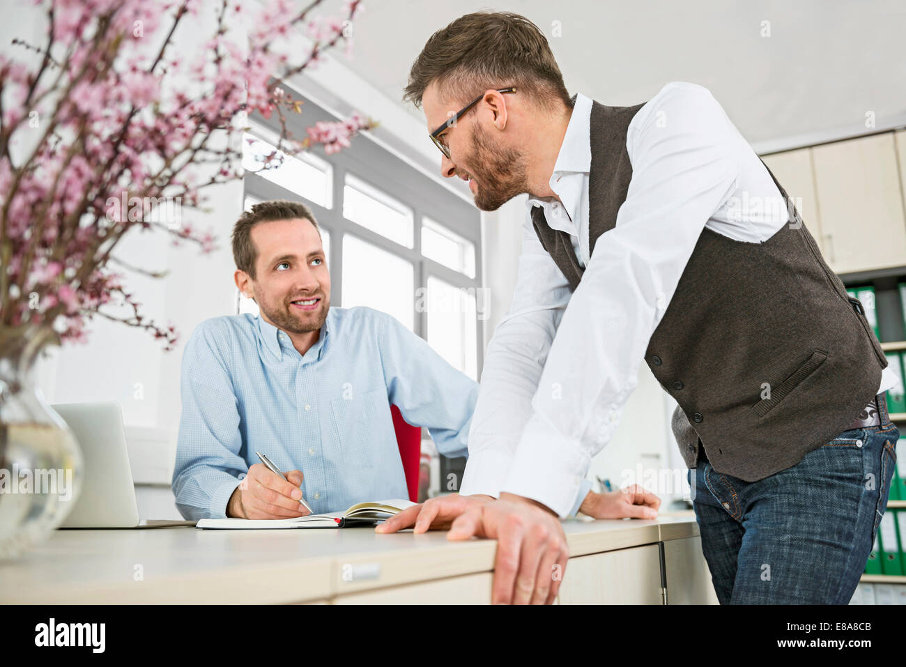 working office colleague talking meeting men Stock Photo - Alamy
