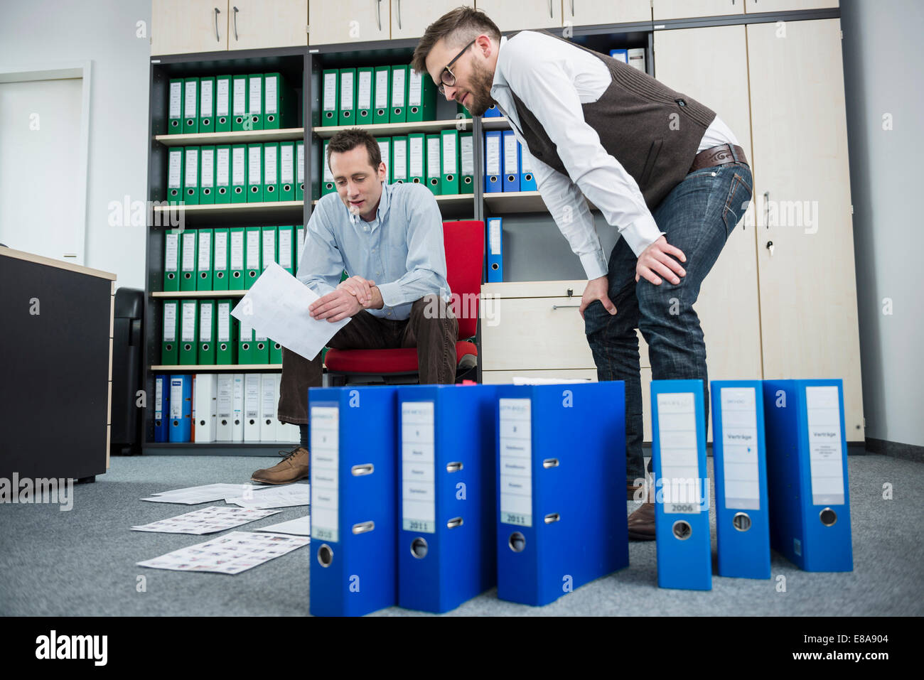 Men office stress busy sorting filing office Stock Photo - Alamy
