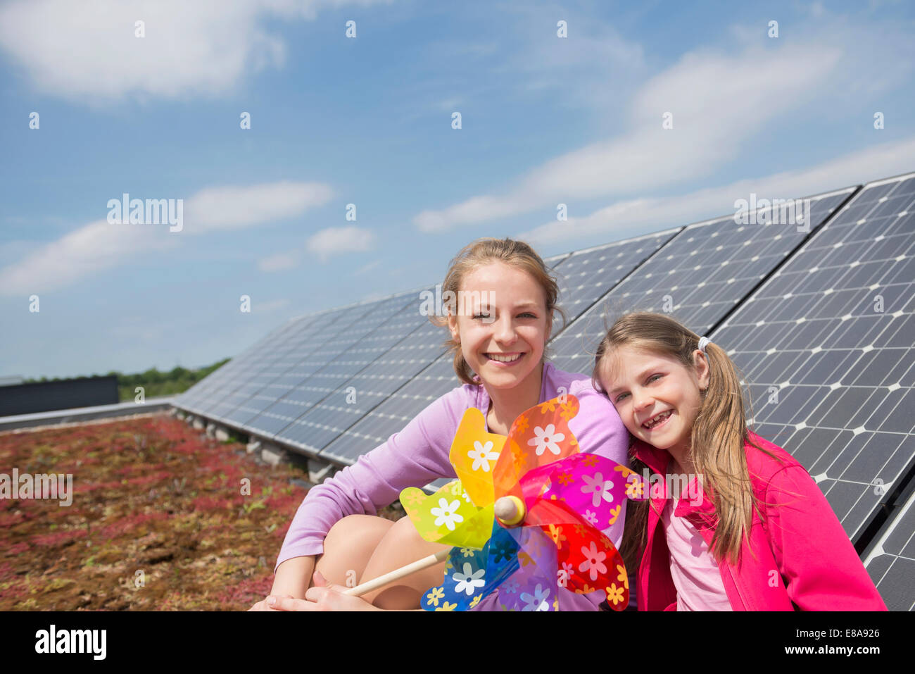Girl with photo voltaic panel hi-res stock photography and images - Alamy