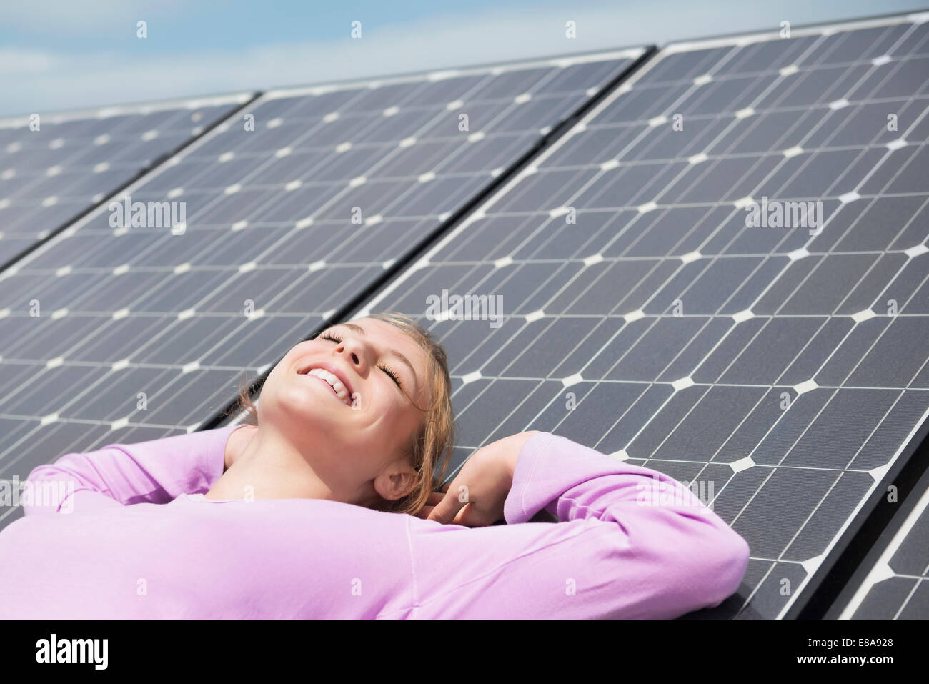 Girl with photo voltaic panel hi-res stock photography and images - Alamy