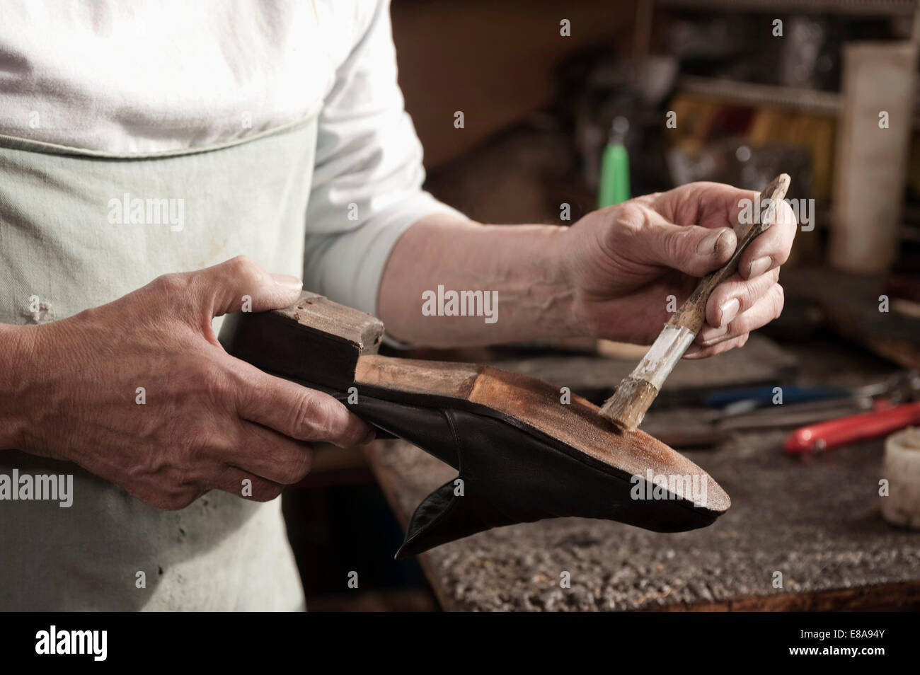 Cobbler working in workshop, close-up Stock Photo - Alamy