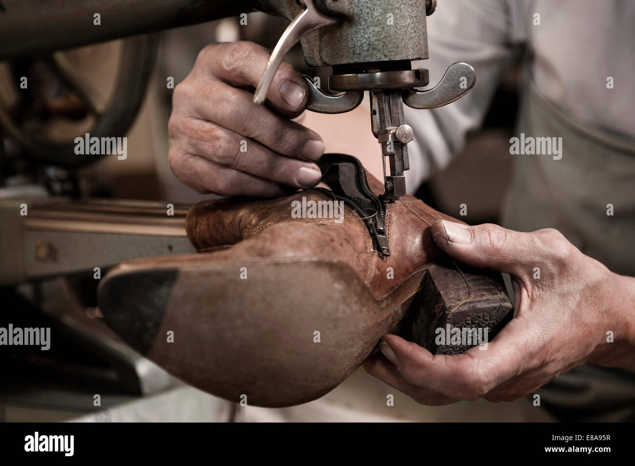 Cobbler working in workshop, close-up Stock Photo - Alamy