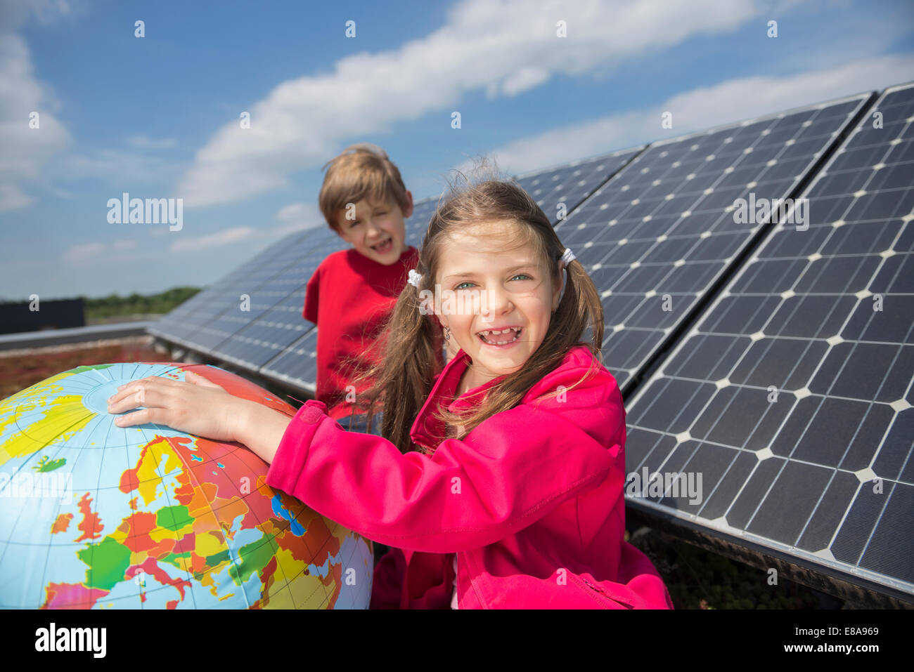 Portrait two kids globe balloon solar panel Stock Photo - Alamy