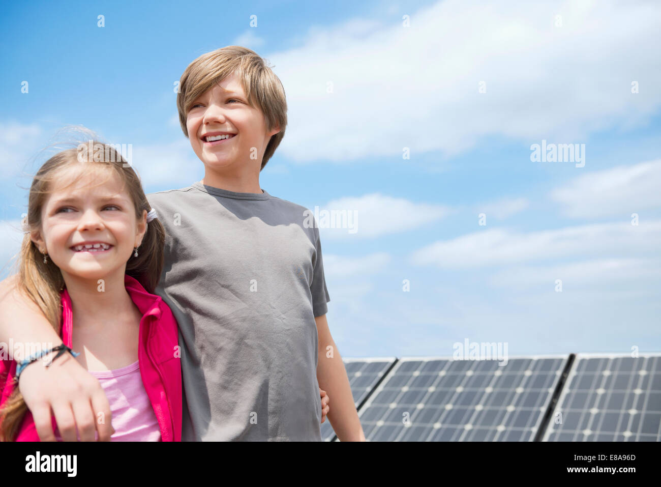 Brother sister portrait smiling solar energy Stock Photo - Alamy