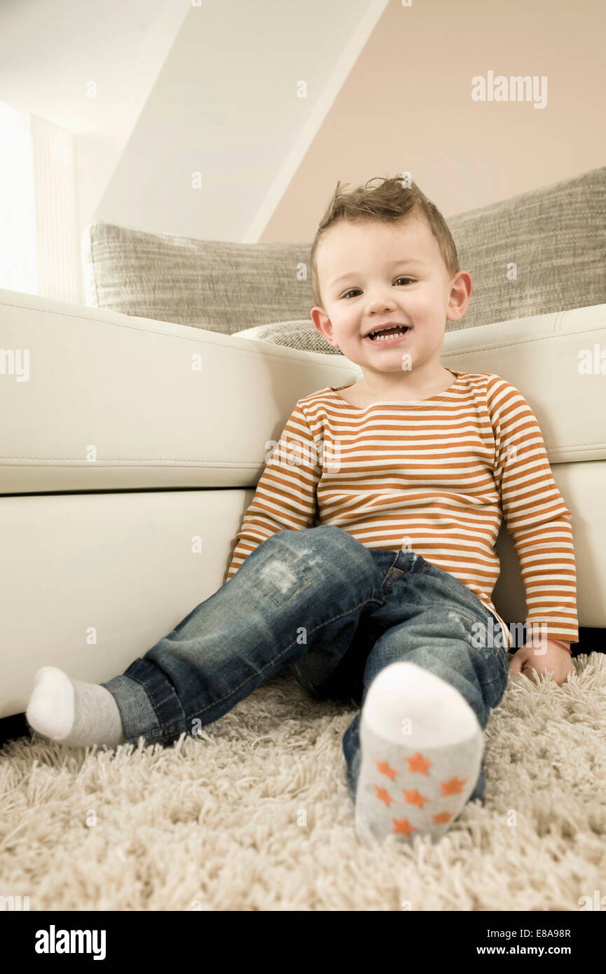 Portrait Of Boy Sitting On Rug High Resolution Stock Photography and ...